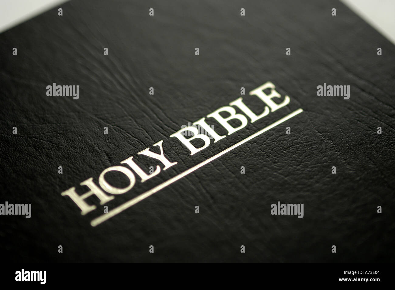 Holy Bible front cover silver lettering underlined Stock Photo - Alamy