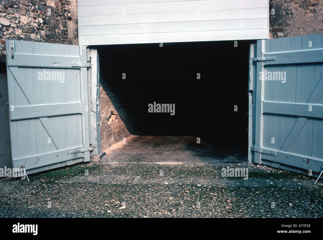 Garage with wide open doors Stock Photo - Alamy