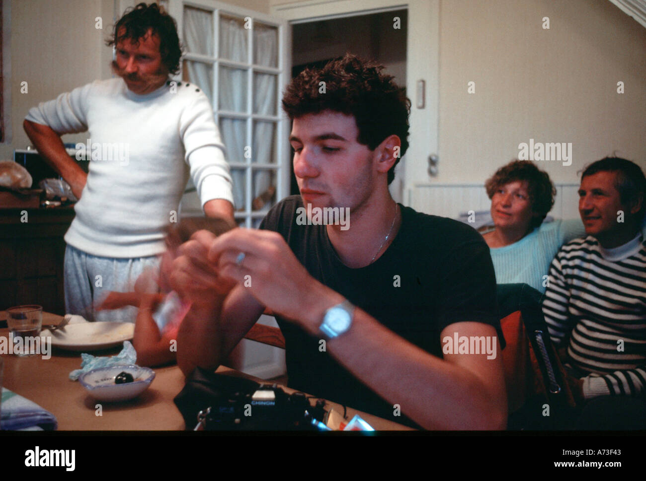 Young French man with family members Stock Photo - Alamy