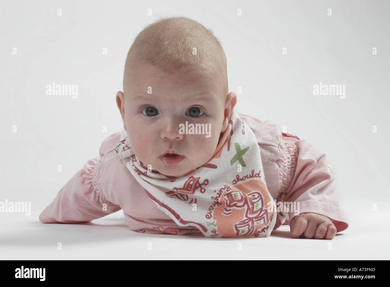 baby girl looking towards camera Stock Photo - Alamy