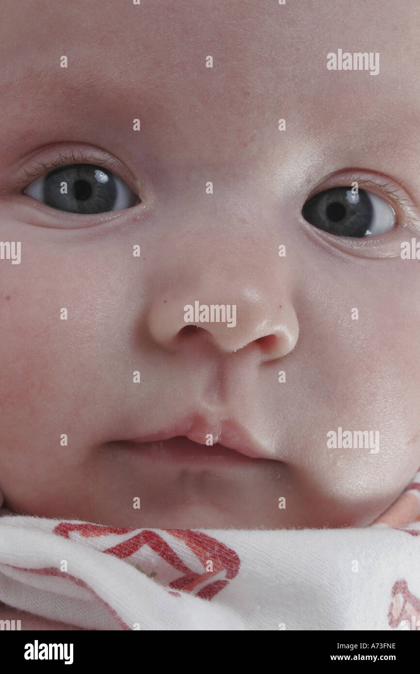 baby girl looking towards camera Stock Photo - Alamy