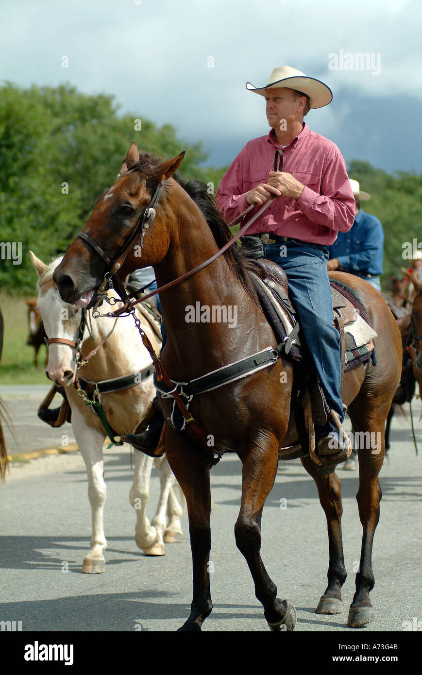A cowboy riding a horse in Bandera Texas Stock Photo - Alamy