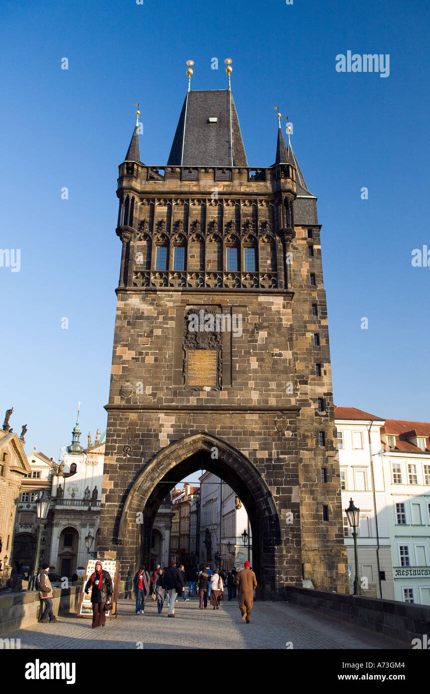 Old Town Bridge Tower, Prague, leading onto Charles Bridge with famous religious sculptures ...