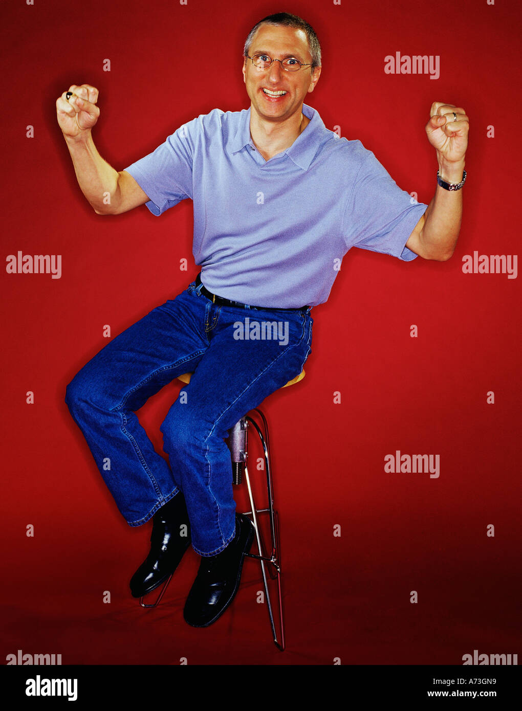 Man sitting on stool hi-res stock photography and images - Alamy