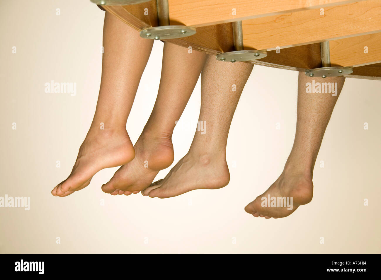 Feet Hanging Over Balcony Stock Photo - Alamy