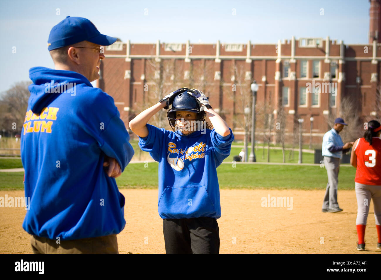 Young high school girl playing softball, Winnemac Park, Chicago, IL USA ...
