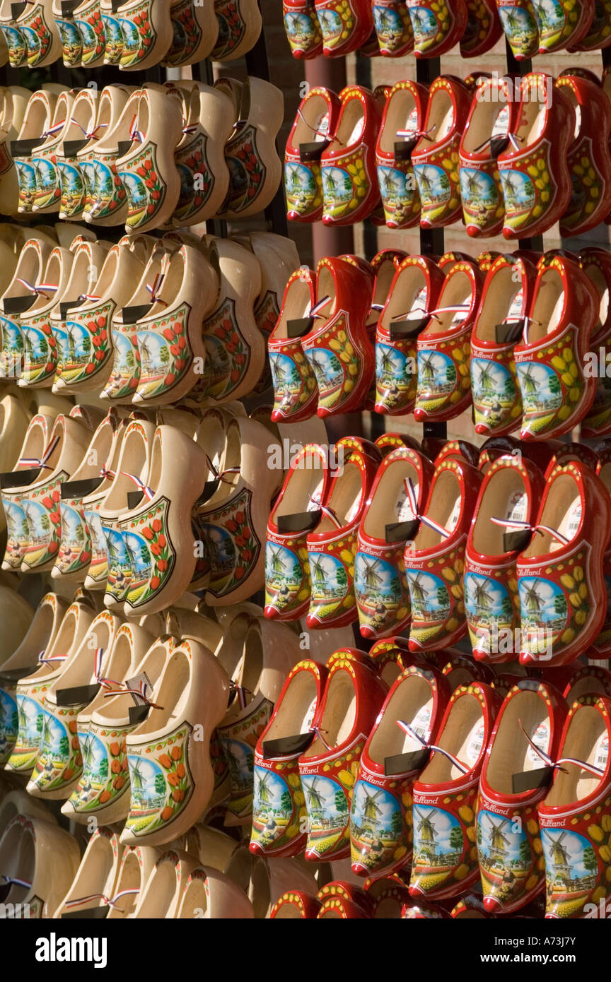 Row of clogs Sabot or Dutch wooden shoes painted with windmill and ...