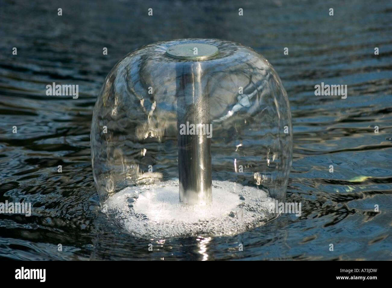Small water bulb fountain in pond, Keukenhof gardens, Lisse, Holland ...
