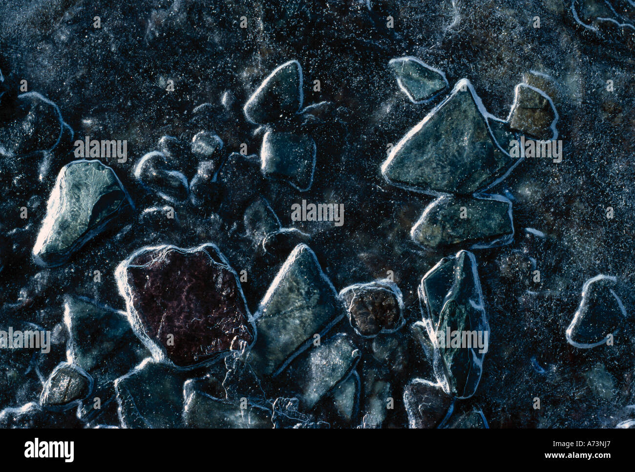 Ice on stones Stock Photo - Alamy