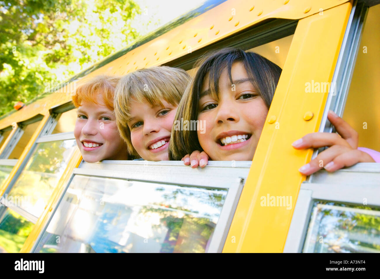 Smiling children on school bus Stock Photo - Alamy