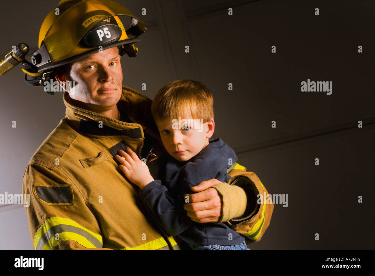 Fireman rescuing child Stock Photo - Alamy Fireman rescuing child Stock Photo - Alamy