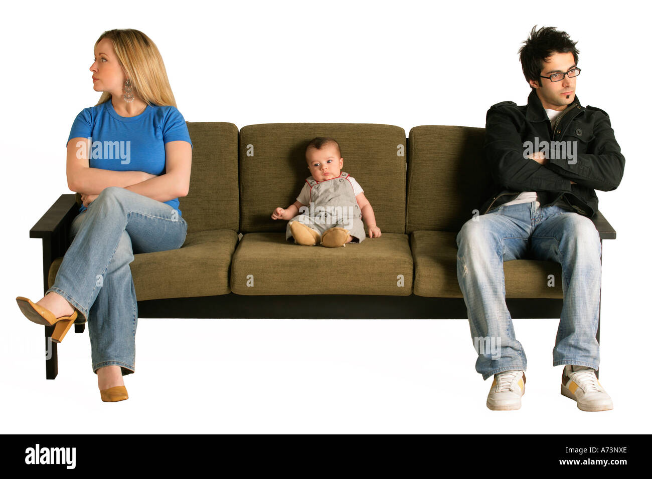 Couple fighting with child caught in the middle Stock Photo - Alamy