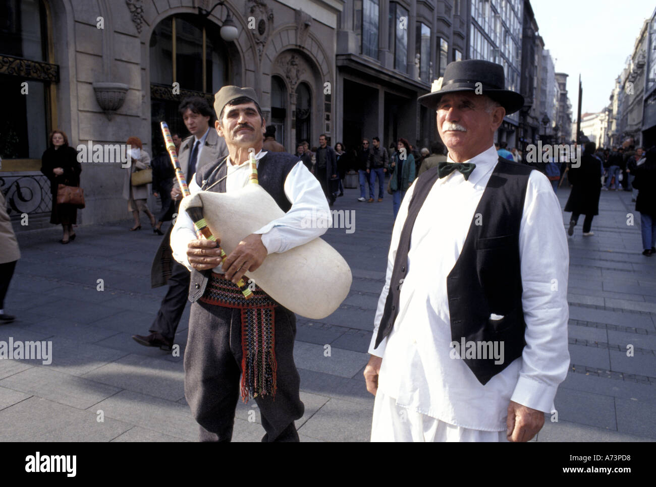 Europe, Serbia, Belgrade Man playing traditional instrument Stock Photo ...