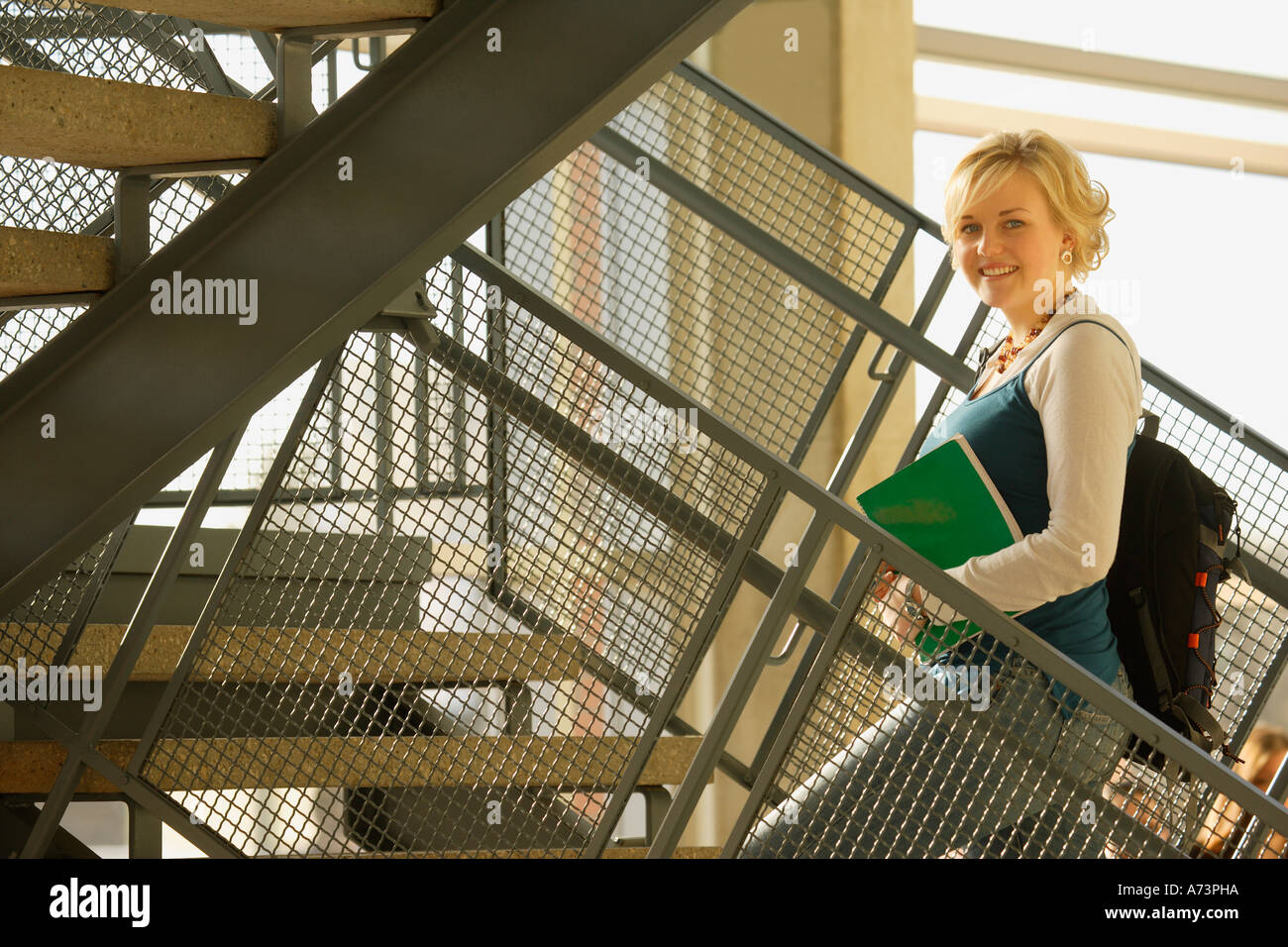 Student going up the stairs Stock Photo - Alamy