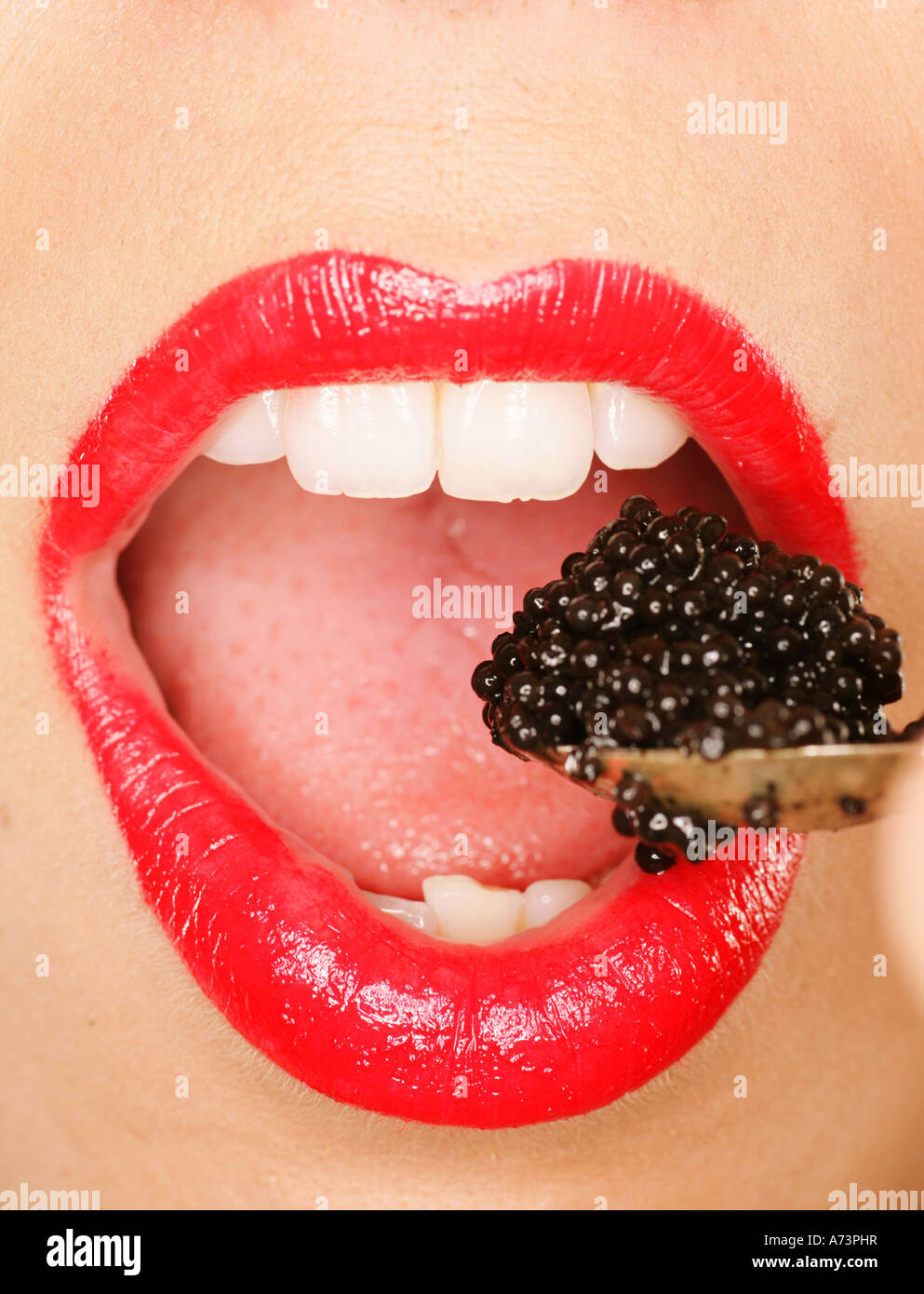 close up of red lips with caviar Stock Photo - Alamy