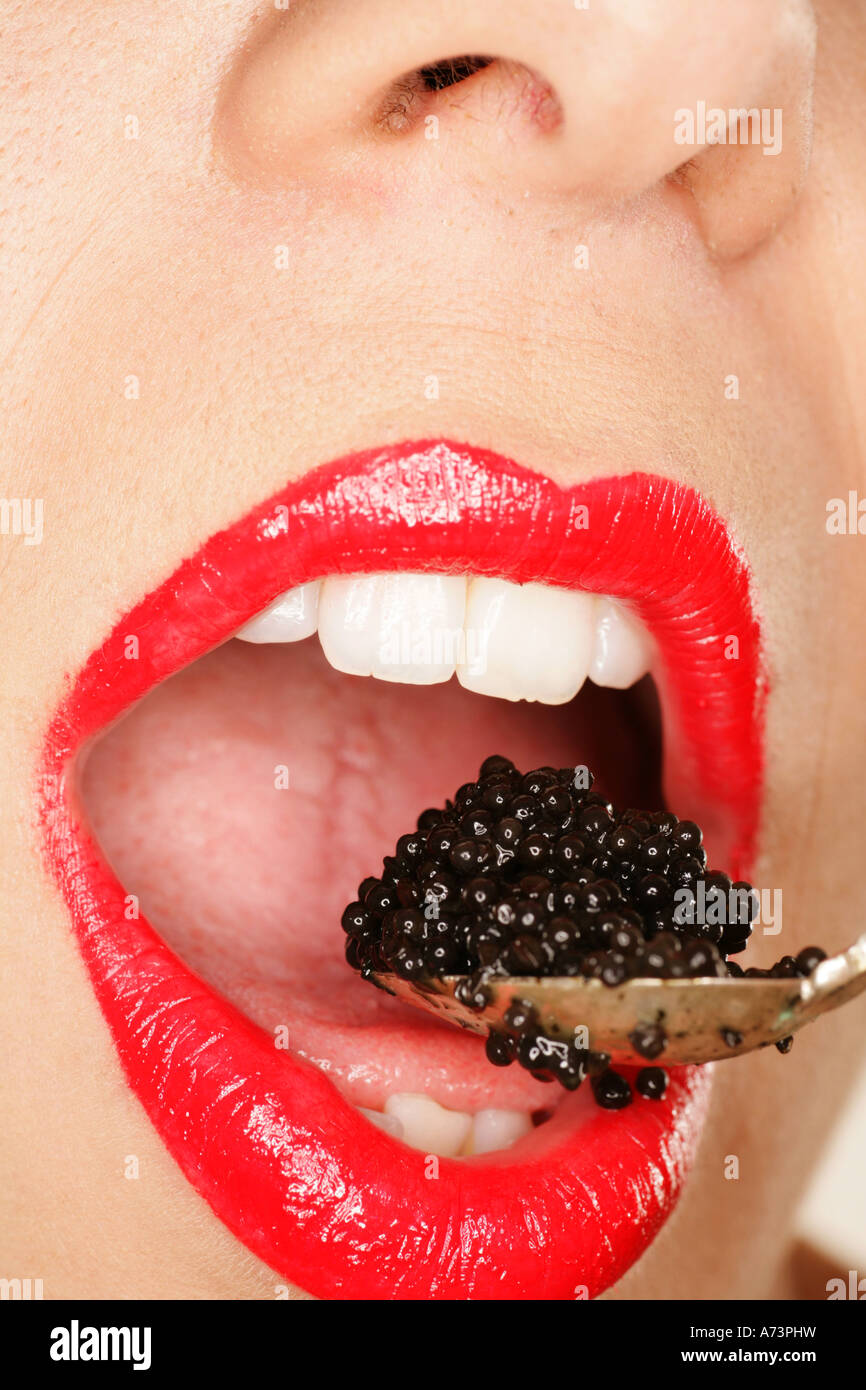 close up of red lips with caviar Stock Photo - Alamy