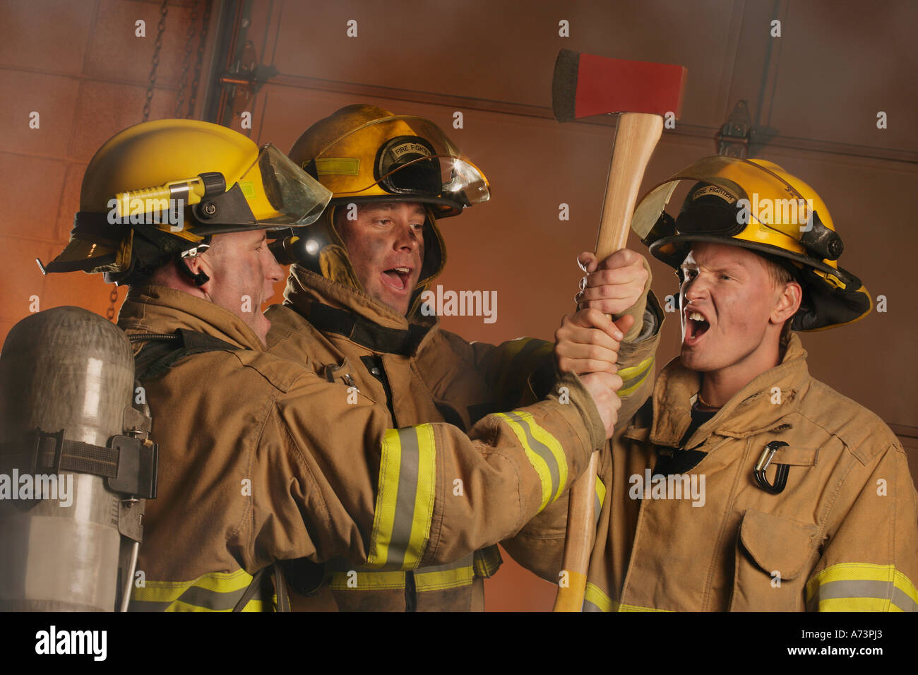 Firefighters with axe Stock Photo - Alamy
