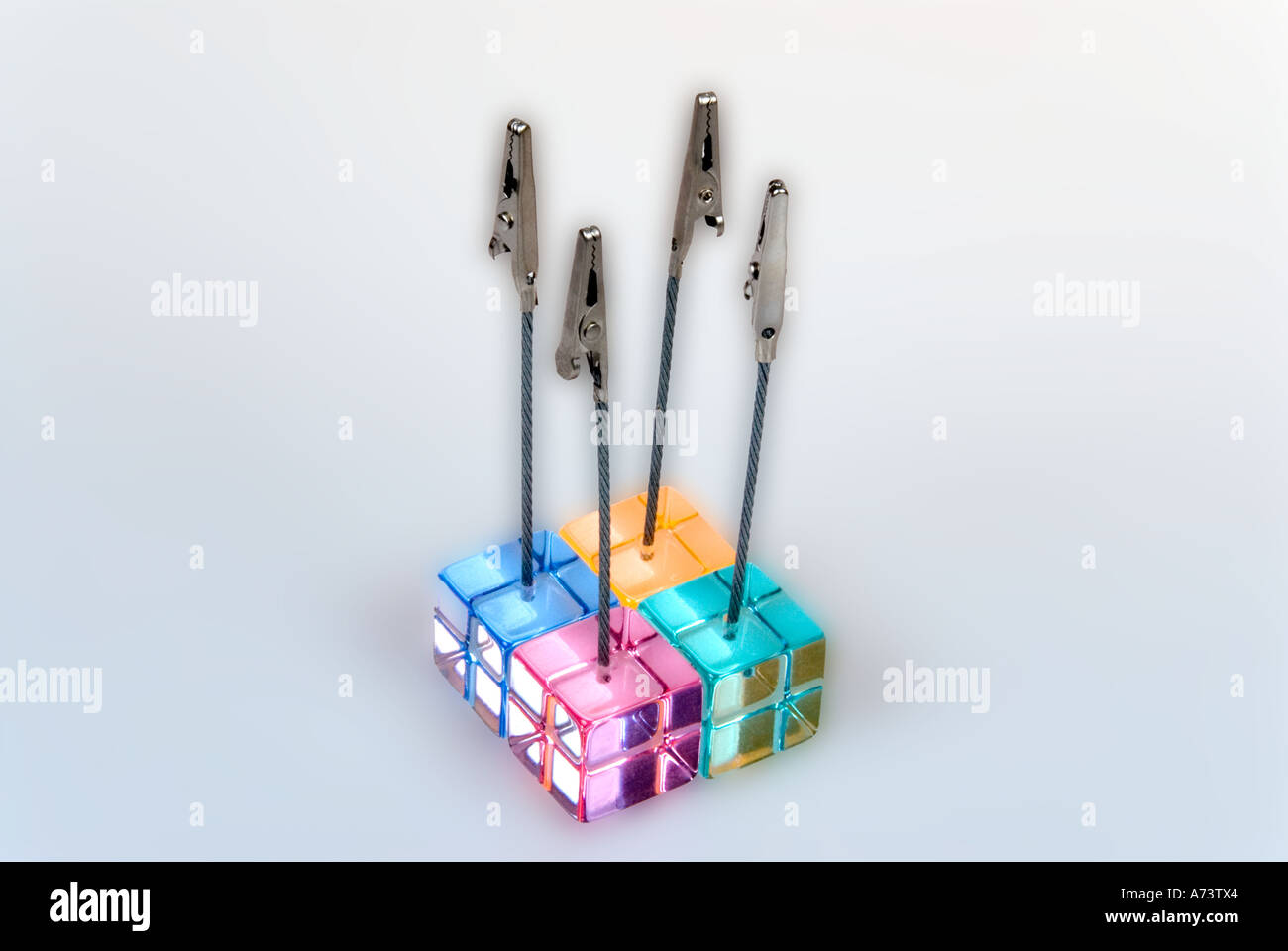 Four acrylic block note holders against a white background grouped ...