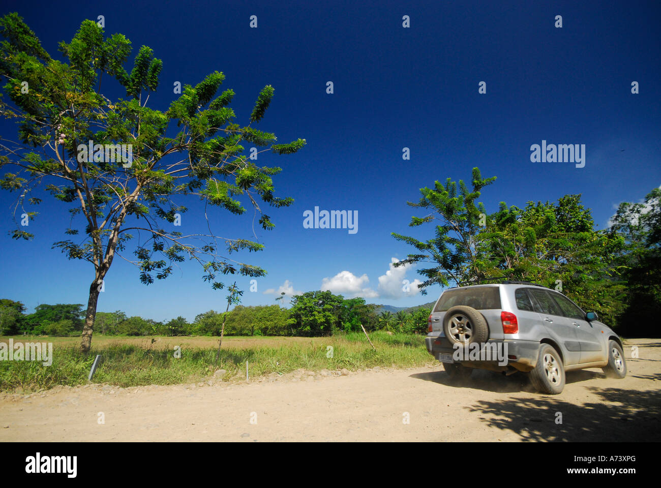 Car passing on street of Matapalo, Puntarenas Province, Cenral Pacific ...