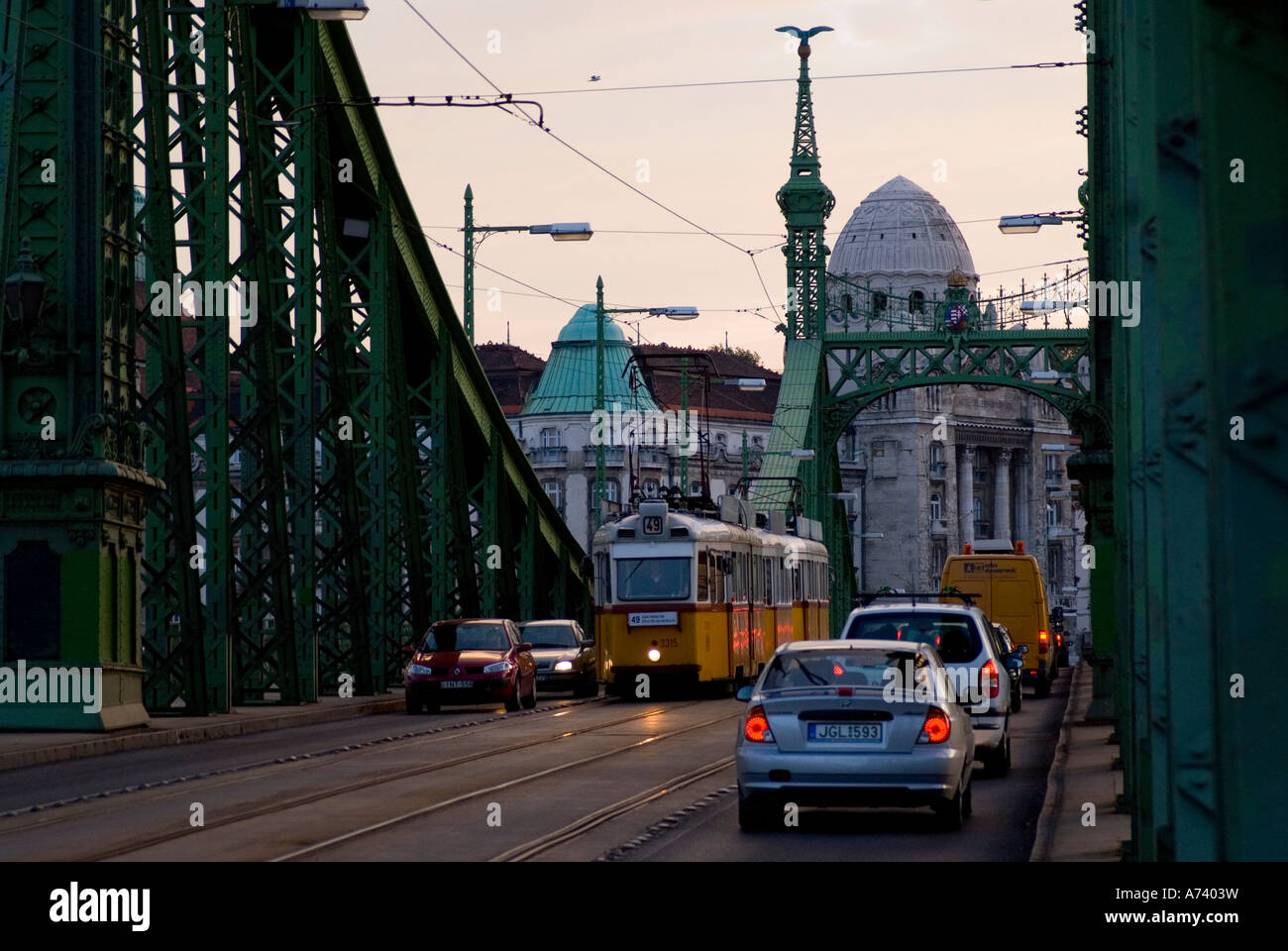 Tram and cars on Liberty bridge in budapest in the background is ...