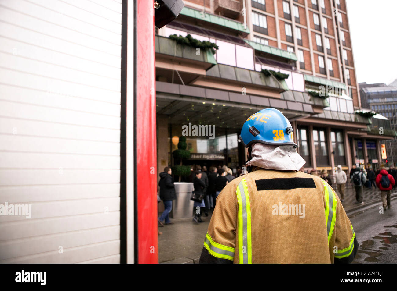 A fireman outside of a hotel downtown oslo Stock Photo - Alamy