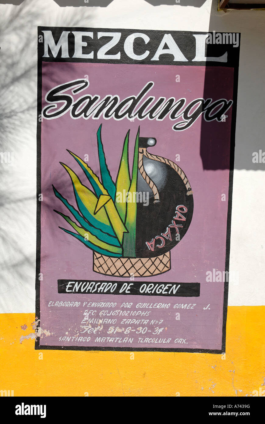 painted advertisement for Mezcal on a wall Mitla Mexico Stock Photo - Alamy