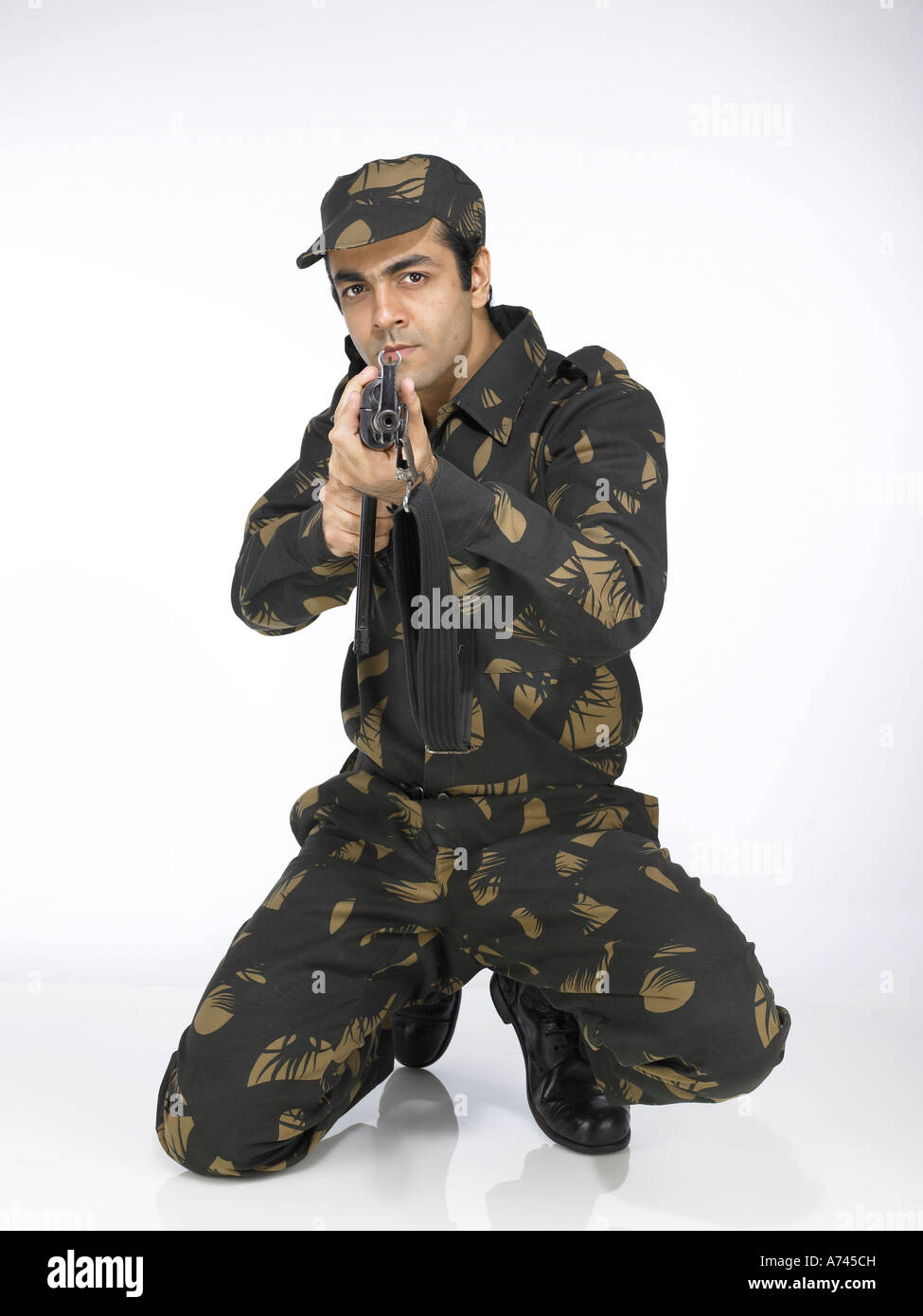 VDA 201718 Indian army soldier sitting on knee pointing AK 47 gun MR ...