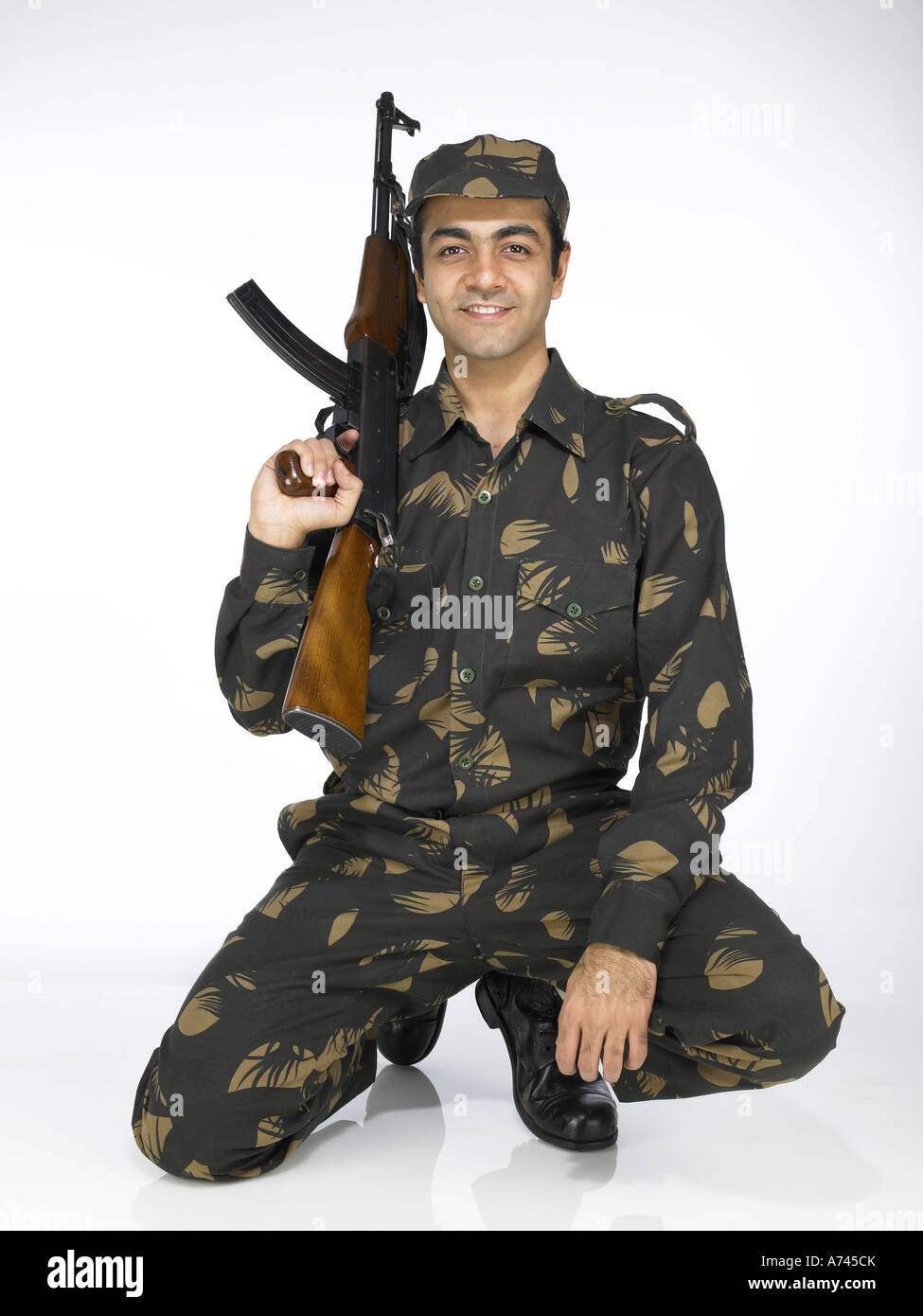 VDA 201720 Indian army soldier sitting on knee holding AK 47 gun MR ...