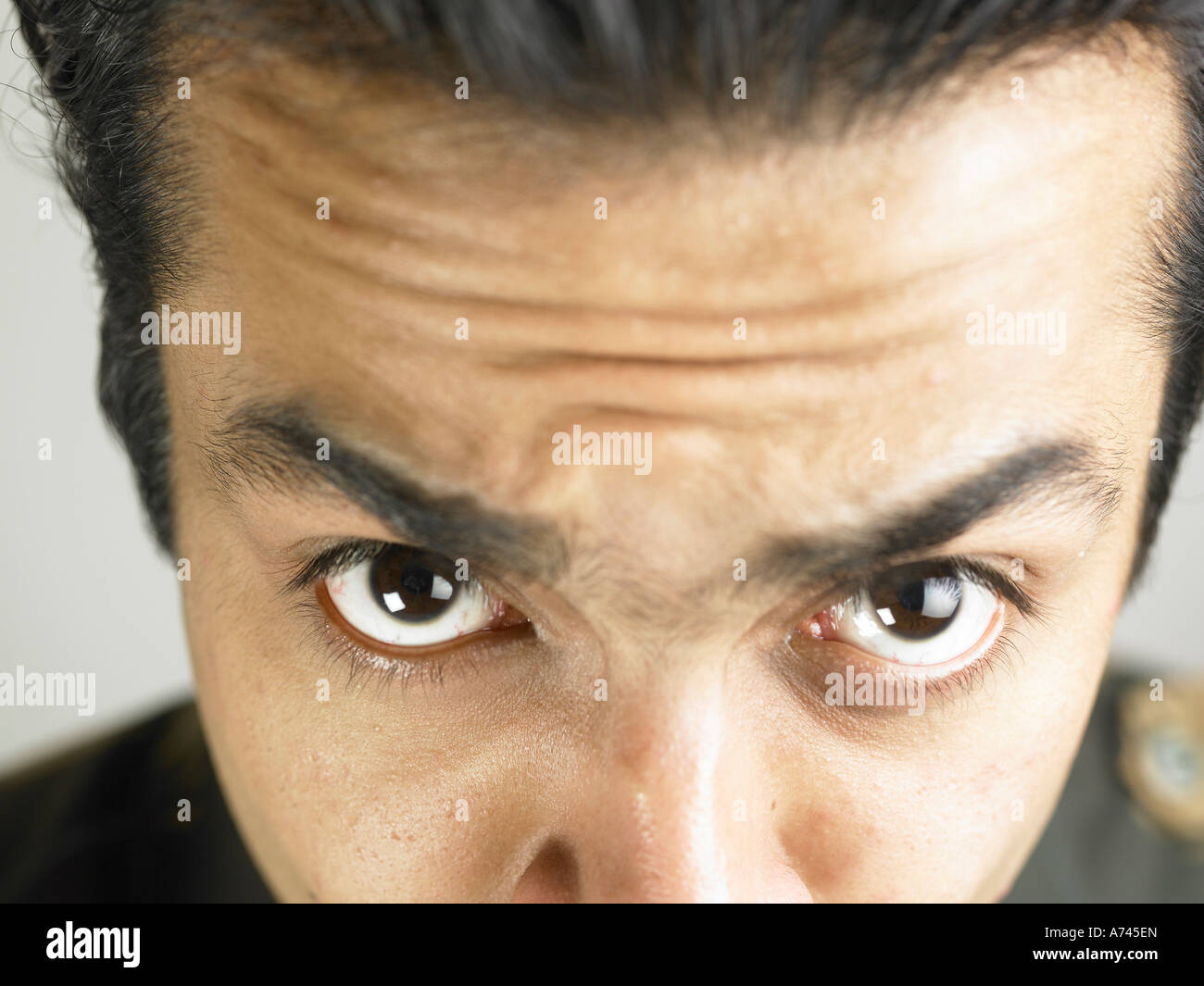 Close up of man in angry expression MR#702A Stock Photo - Alamy