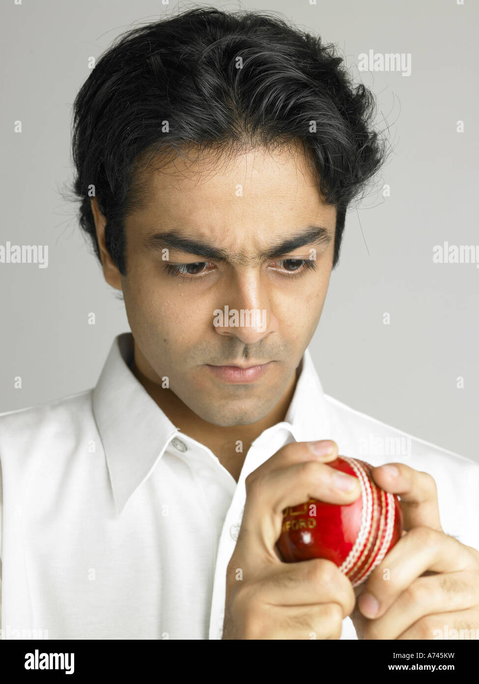 VDA 201801 Indian bowler looking at maroon color cricket ball MR 702A ...