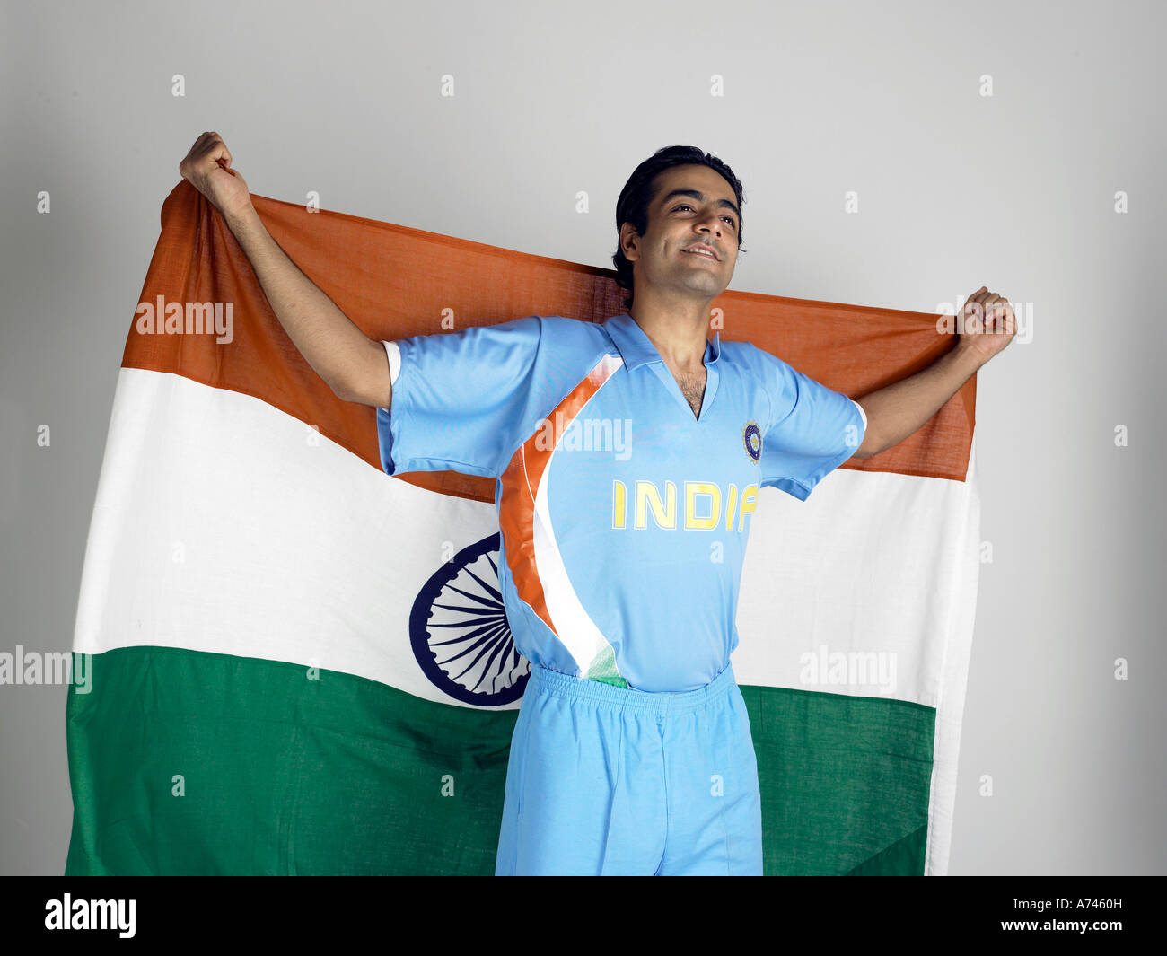 Indian cricket player holding flag of India on his backside Model ...