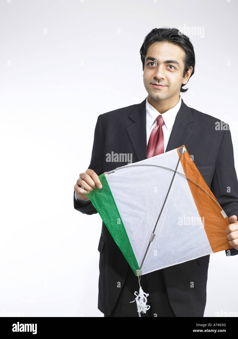 VDA 201906 South Asian Indian executive holding tri color kite in hand ...