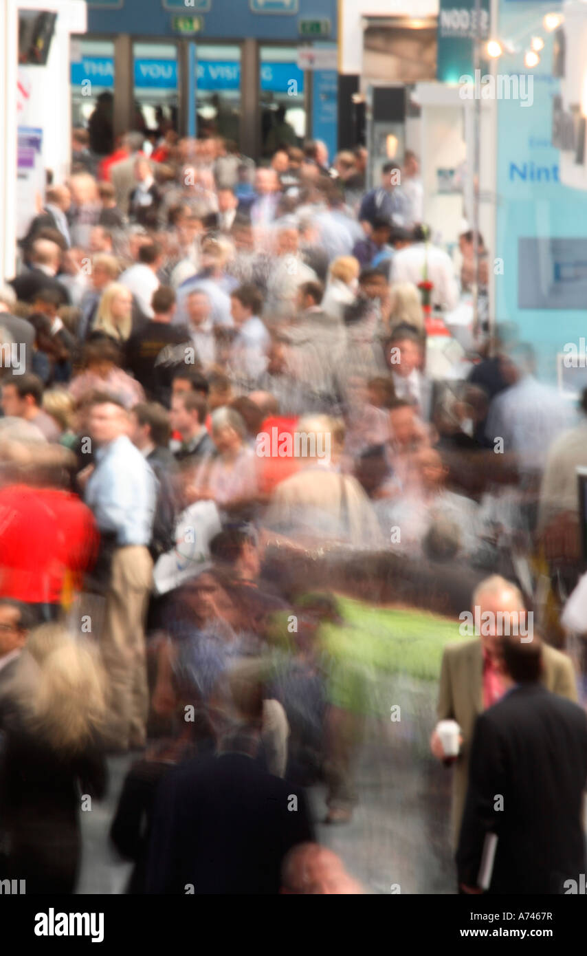 looking down busy aisle of trade show Stock Photo - Alamy