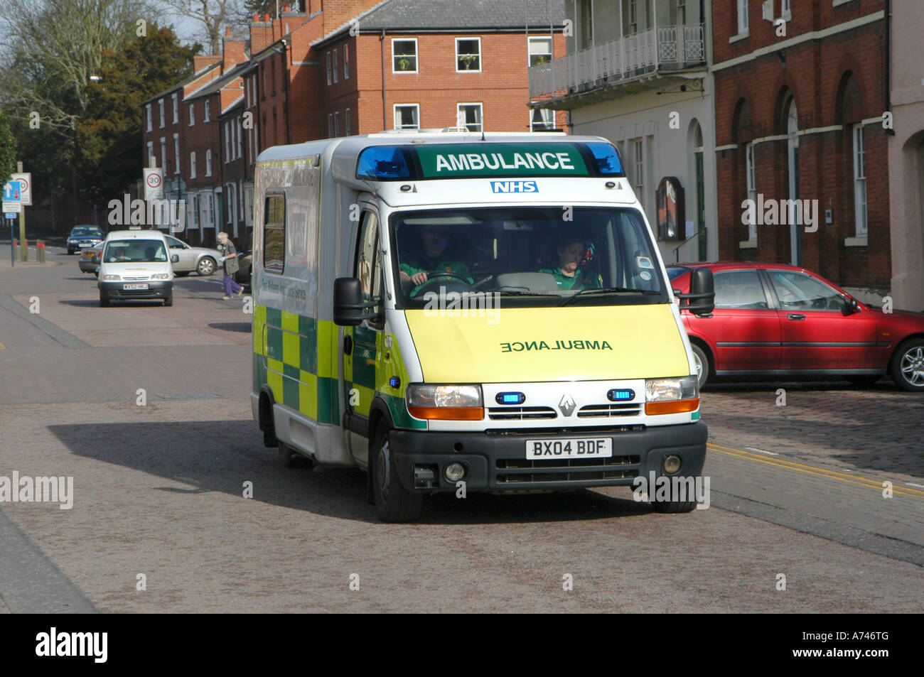 Ambulance speeding into a town centre in the uk Stock Photo - Alamy