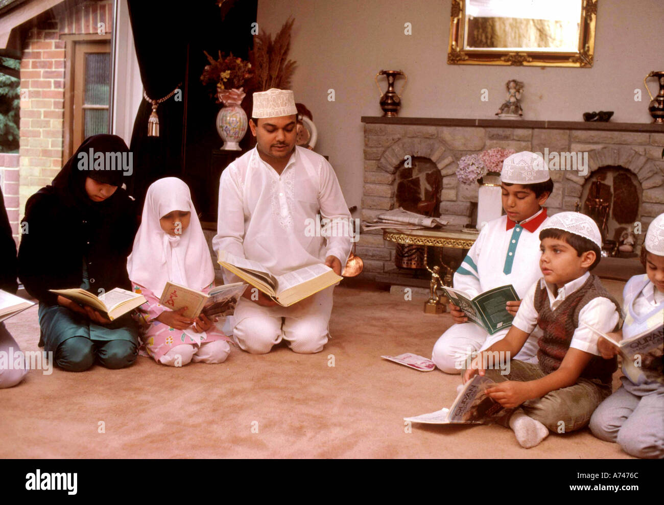 Muslim family at prayer in their home Stock Photo - Alamy