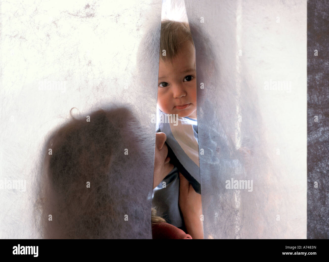 Child by window Stock Photo - Alamy