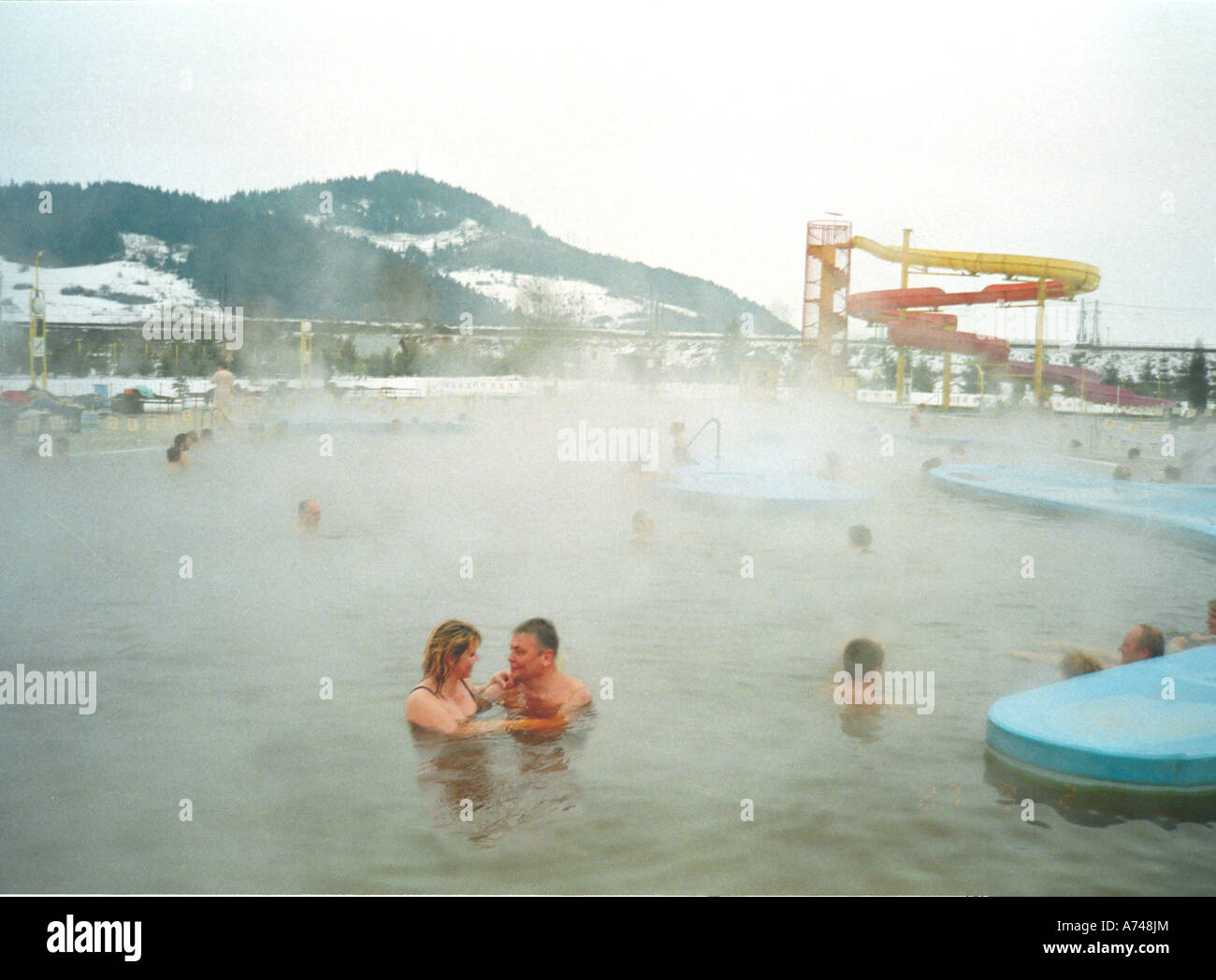 Couple having bath in hot springs Stock Photo - Alamy