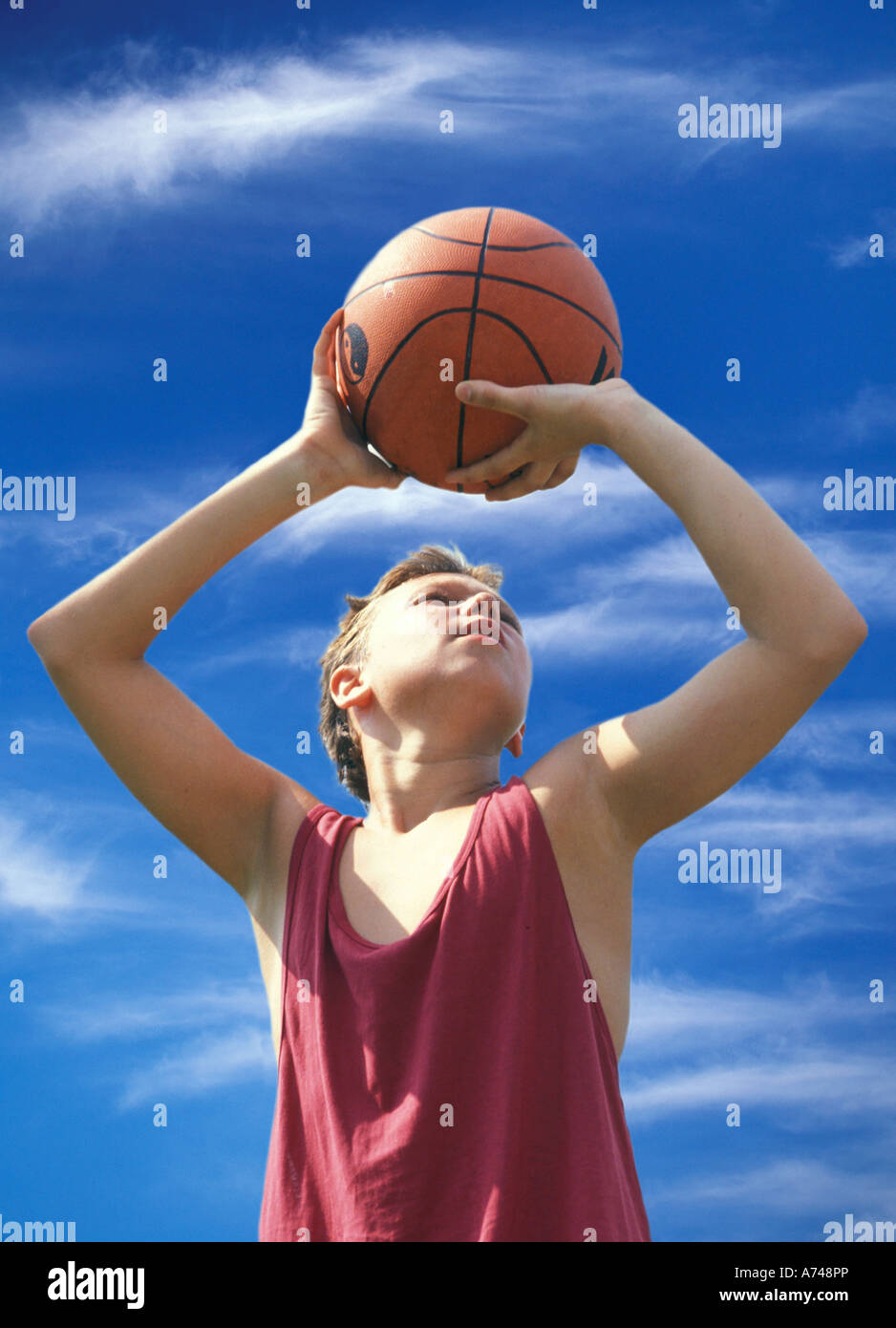 Boy plays basketball Stock Photo - Alamy