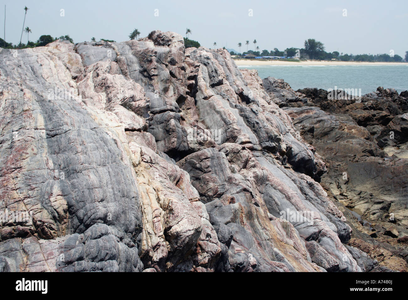 Multi-layered, multi-coloured rock near Kuala Terengganu, Malaysia ...