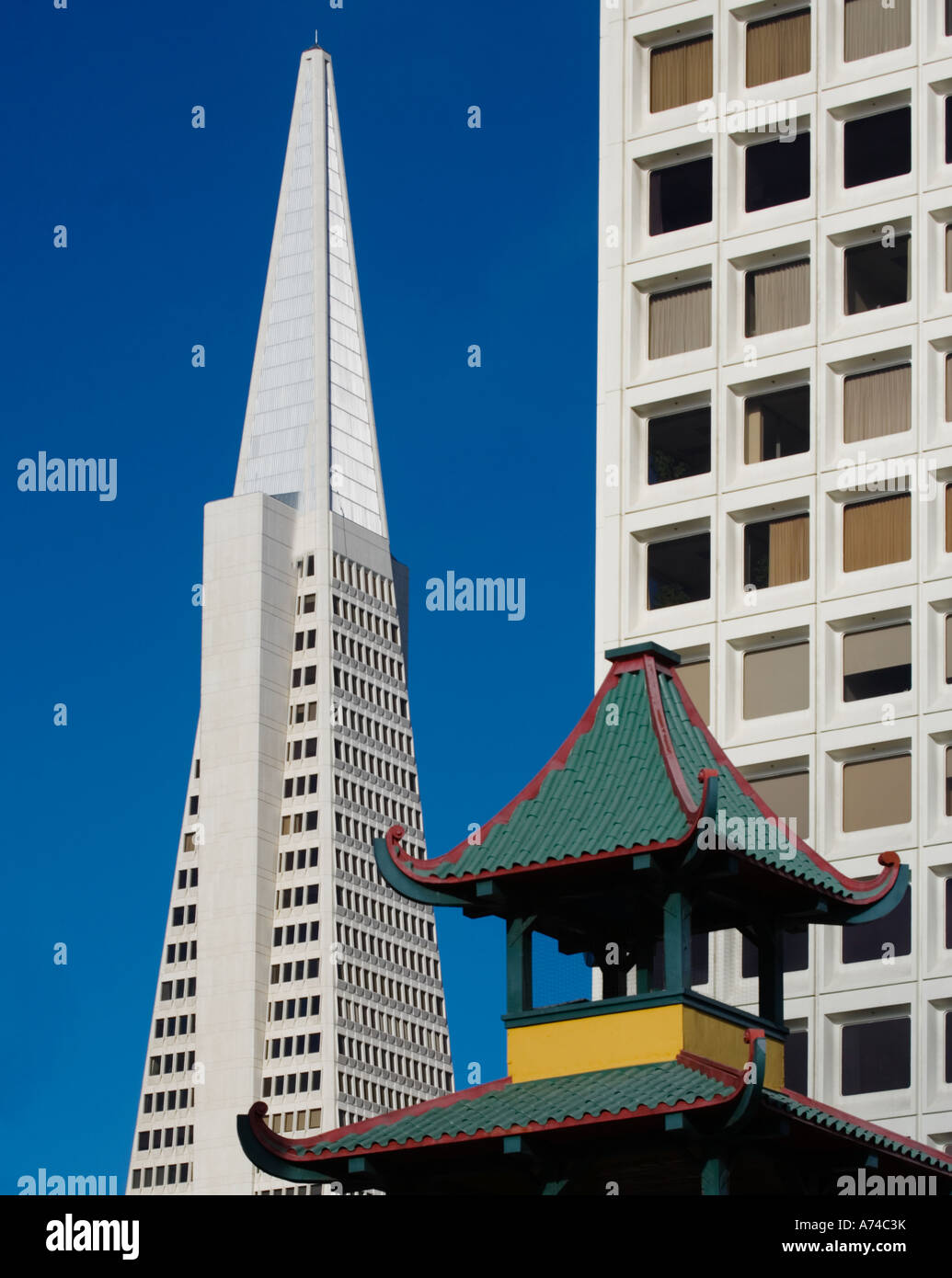 The Transamerica Pyramid Tower sits behind the top of a pagoda topped ...