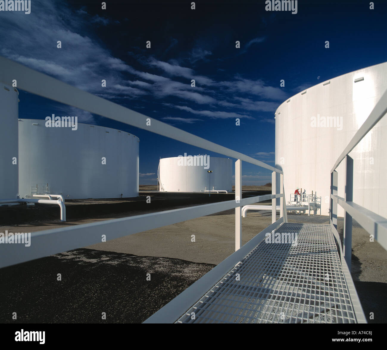 An engineer monitors levels at an oil storage facility Stock Photo - Alamy