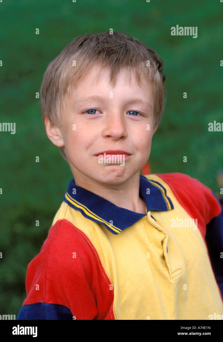 Boy making serious pose Stock Photo - Alamy
