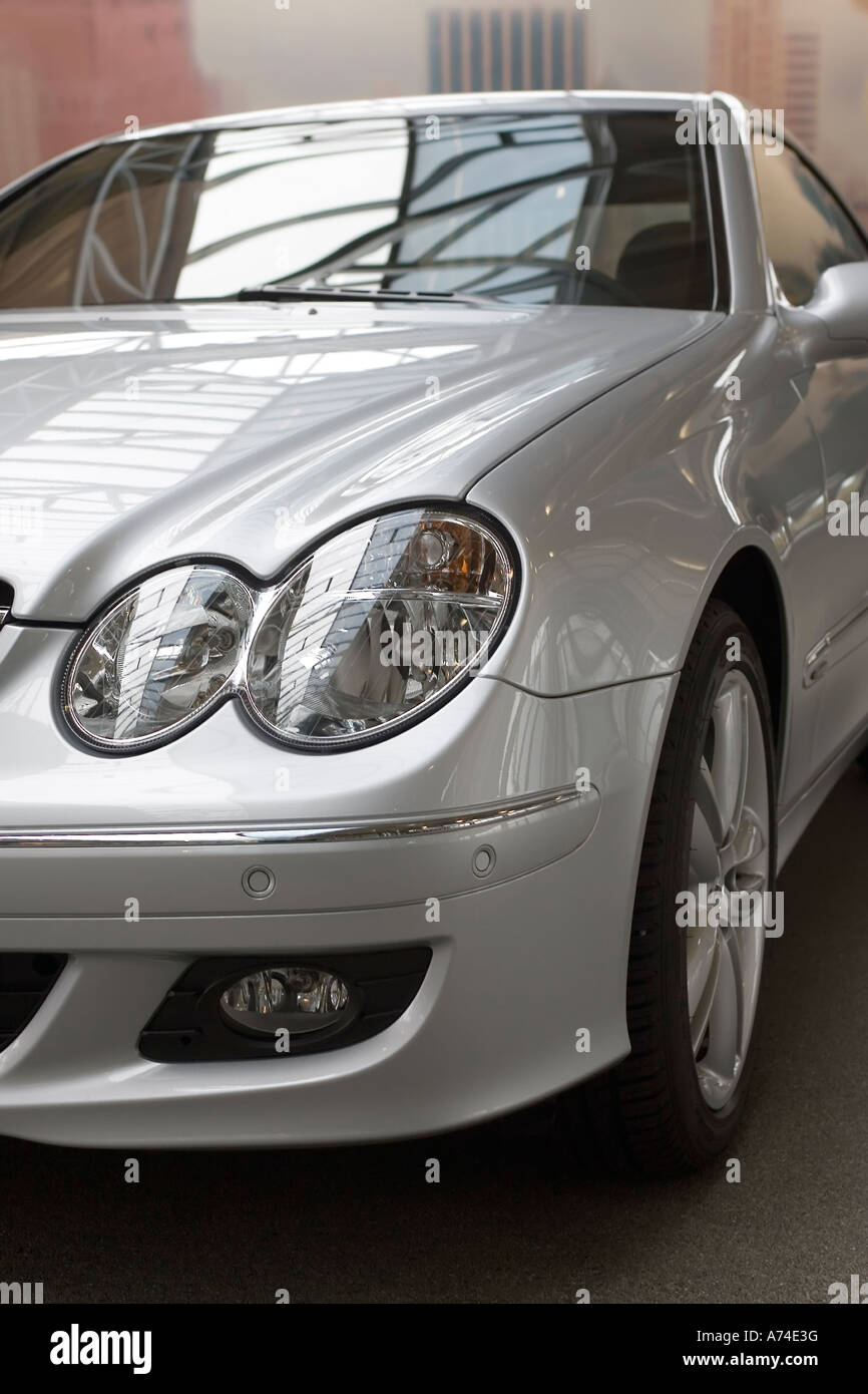 A shiny silver saloon car in a surreal urban landscape Stock Photo - Alamy