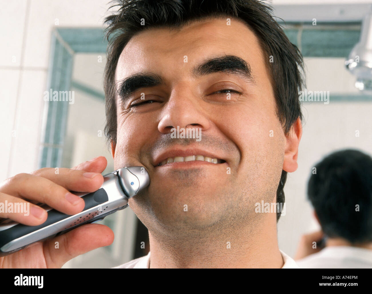 Man shaving in bathroom Stock Photo - Alamy