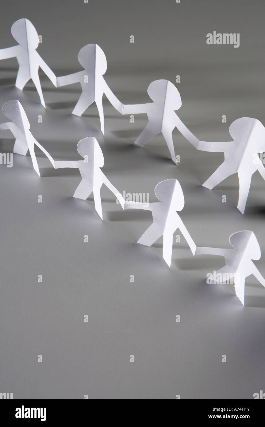 chains of paper people Stock Photo - Alamy