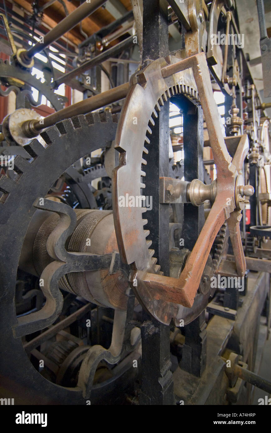Vertical close up of the huge cogs and wheels of the clock inside the ...