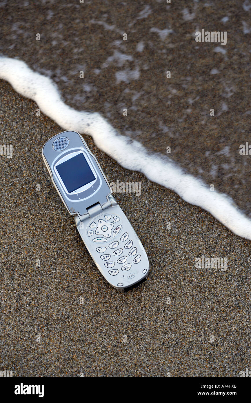 Cell Phone on Beach with Waves Stock Photo - Alamy