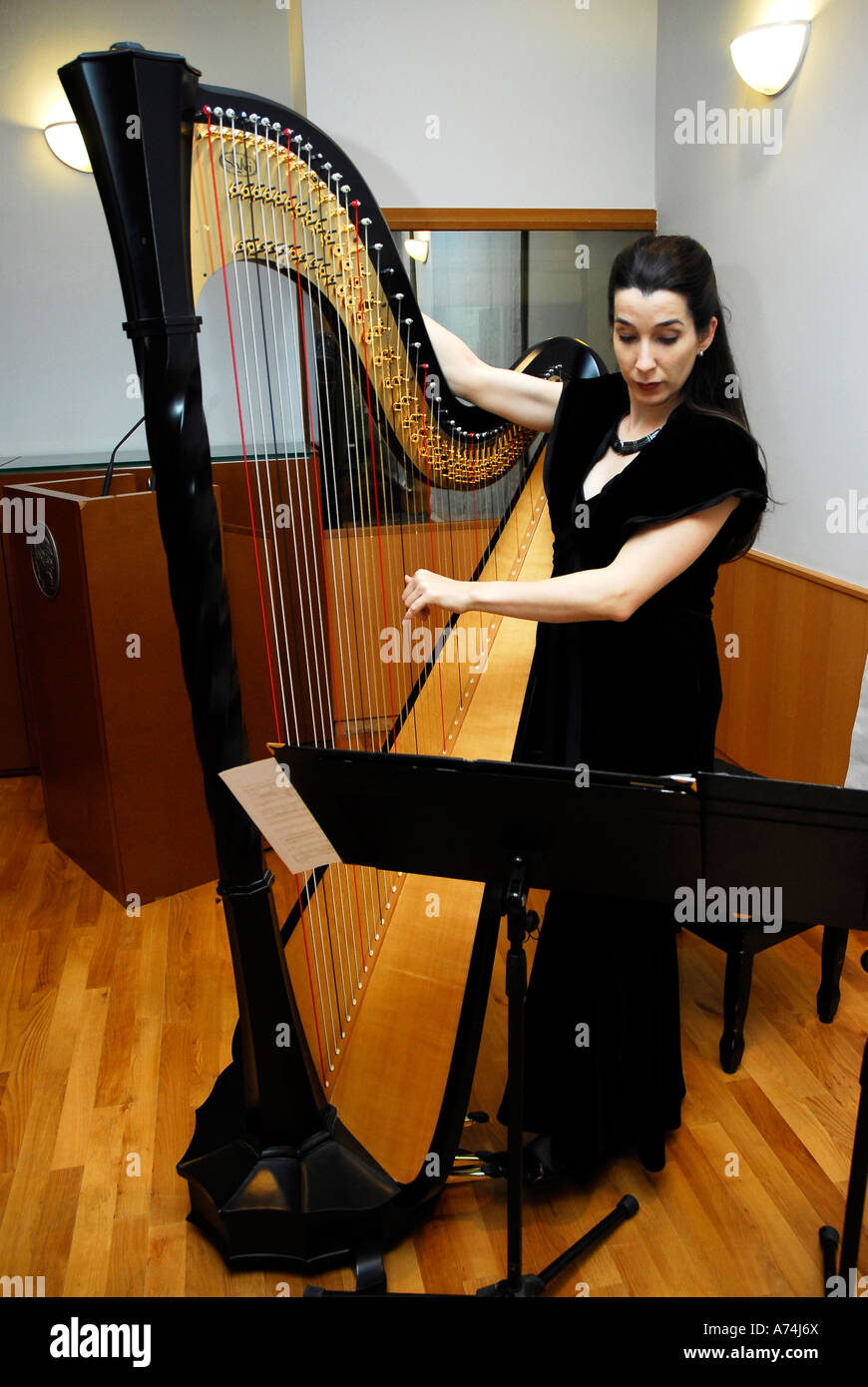 Playing harp hi-res stock photography and images - Alamy