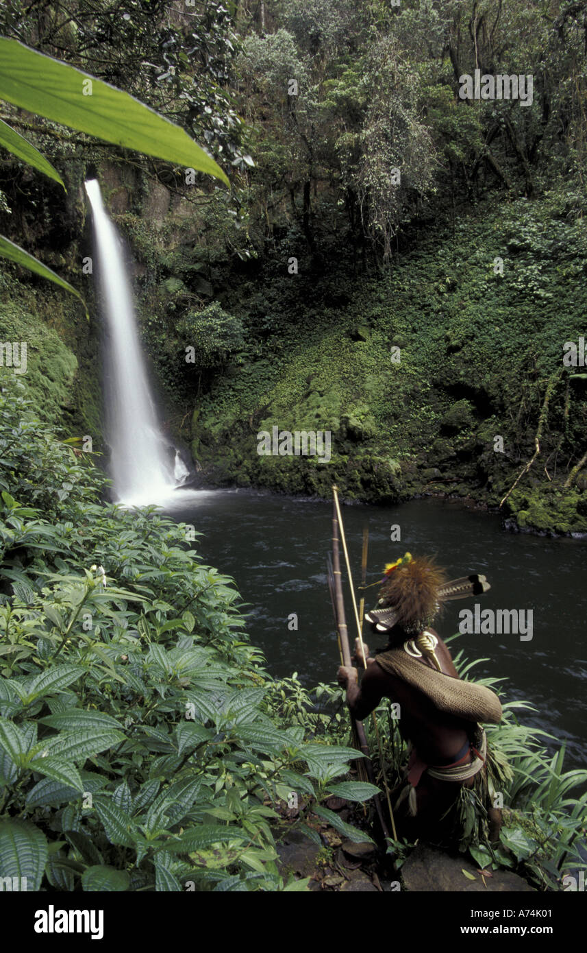 Asia, Papua New Guinea, Highland territory. Huli Wigman at Ambua Falls ...