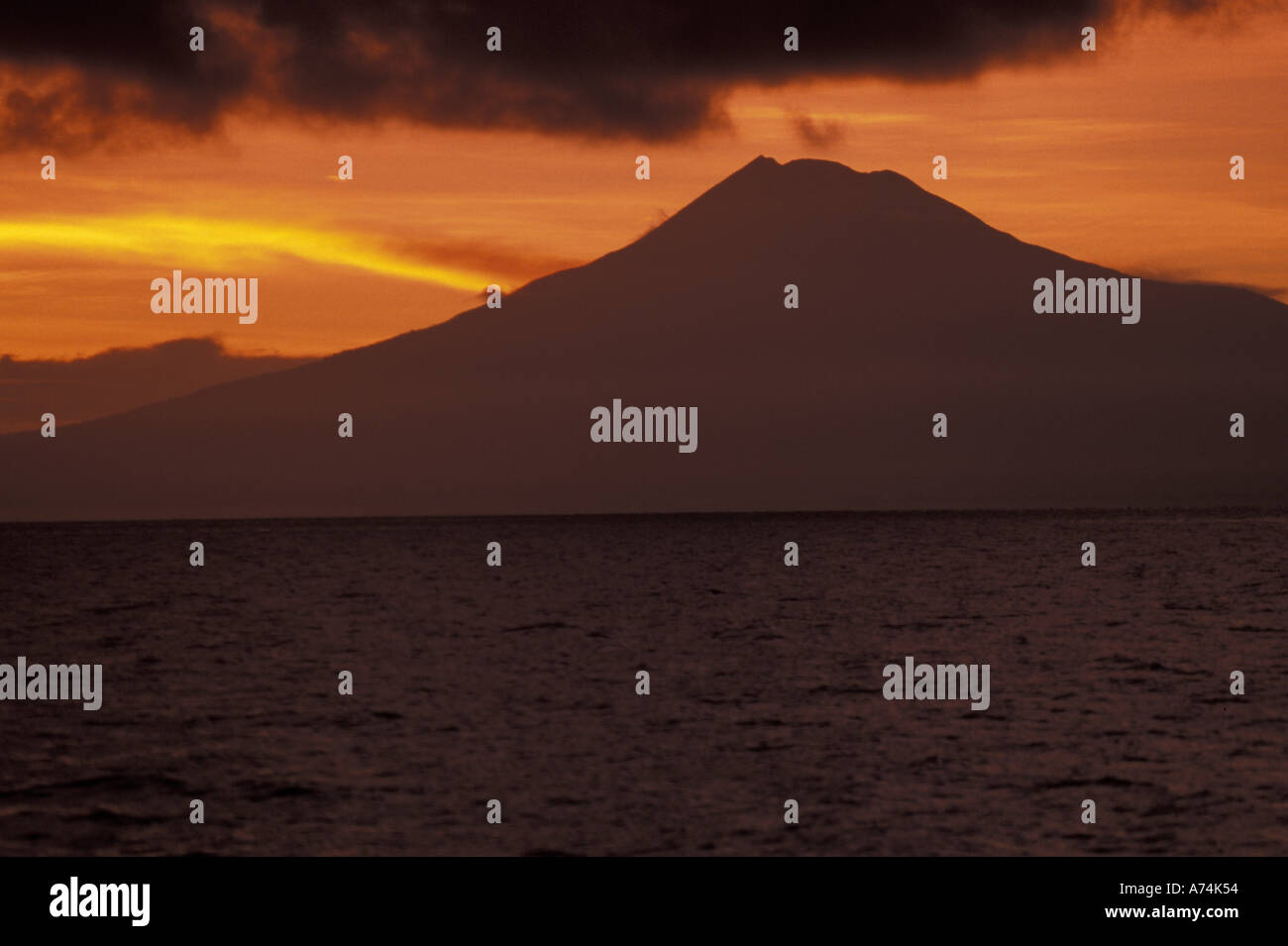Asia, Papua New Guinea, Kimbe Bay. Volcano at sunset Stock Photo - Alamy